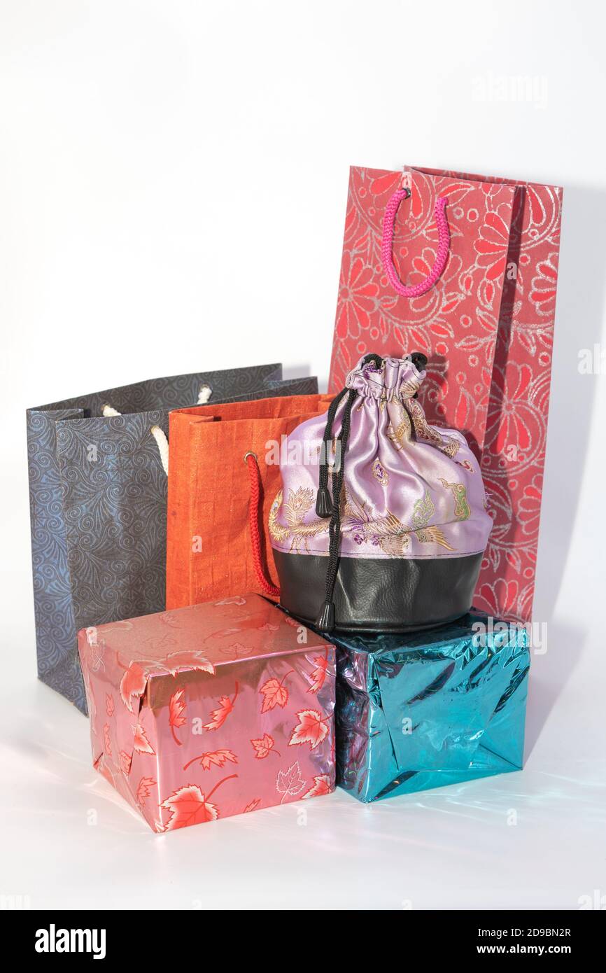 Colorful paper bags and gift boxes and pouch Stock Photo - Alamy