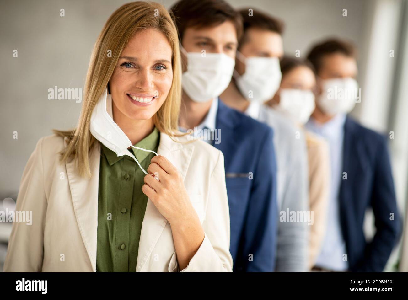 Business team taking off face hi-res stock photography and images - Alamy