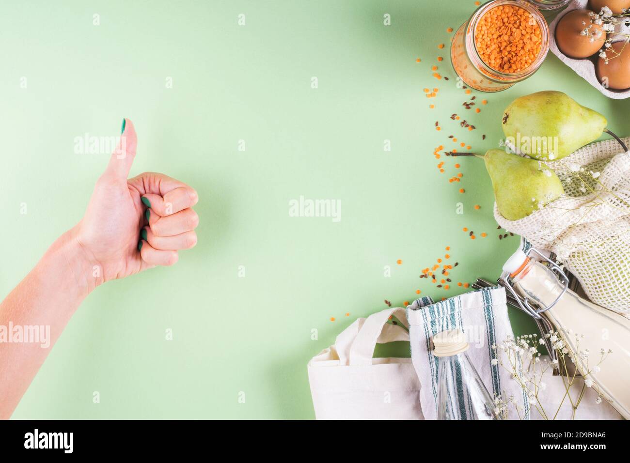 Green zero waste background with accessories Stock Photo - Alamy