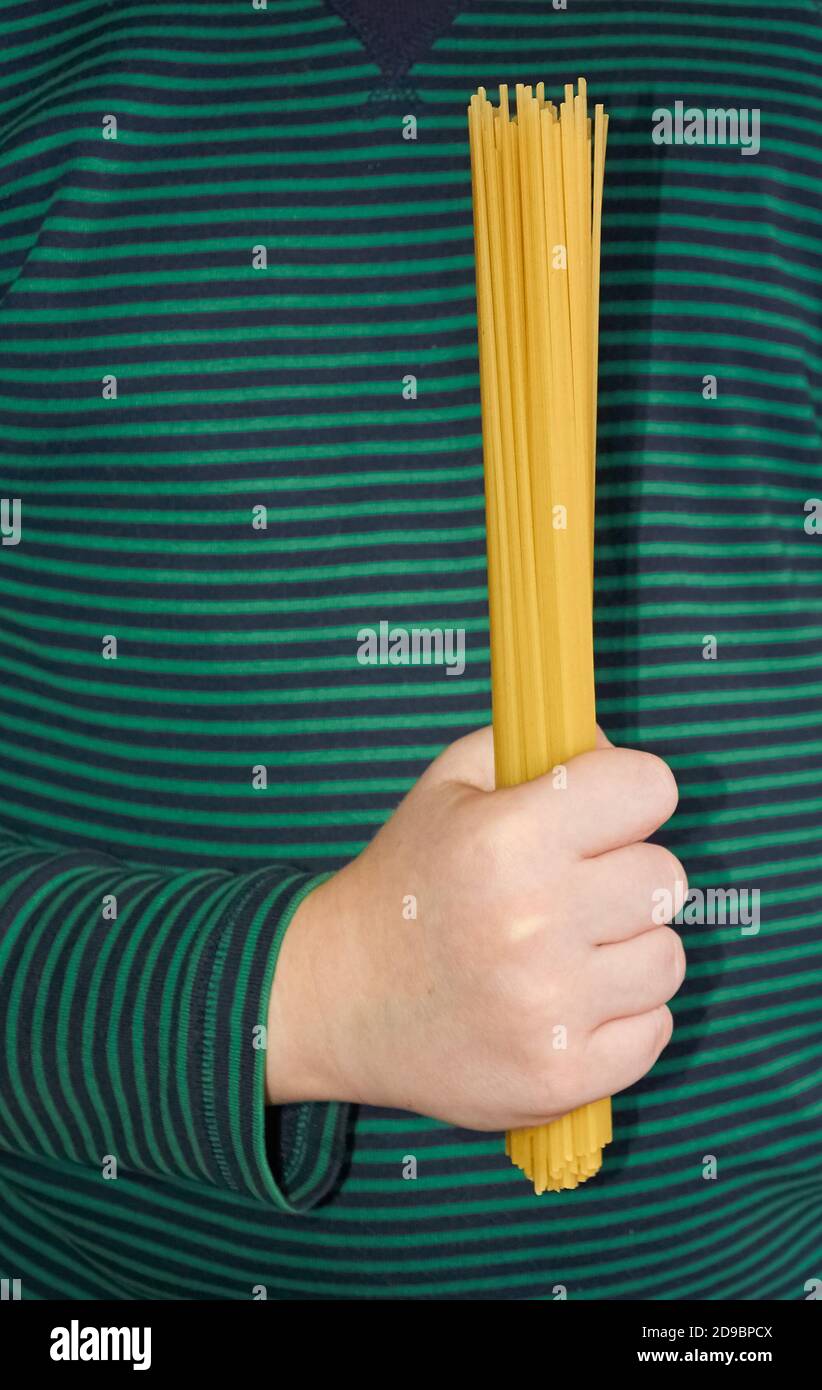 Hand with spaghetti hi-res stock photography and images - Alamy