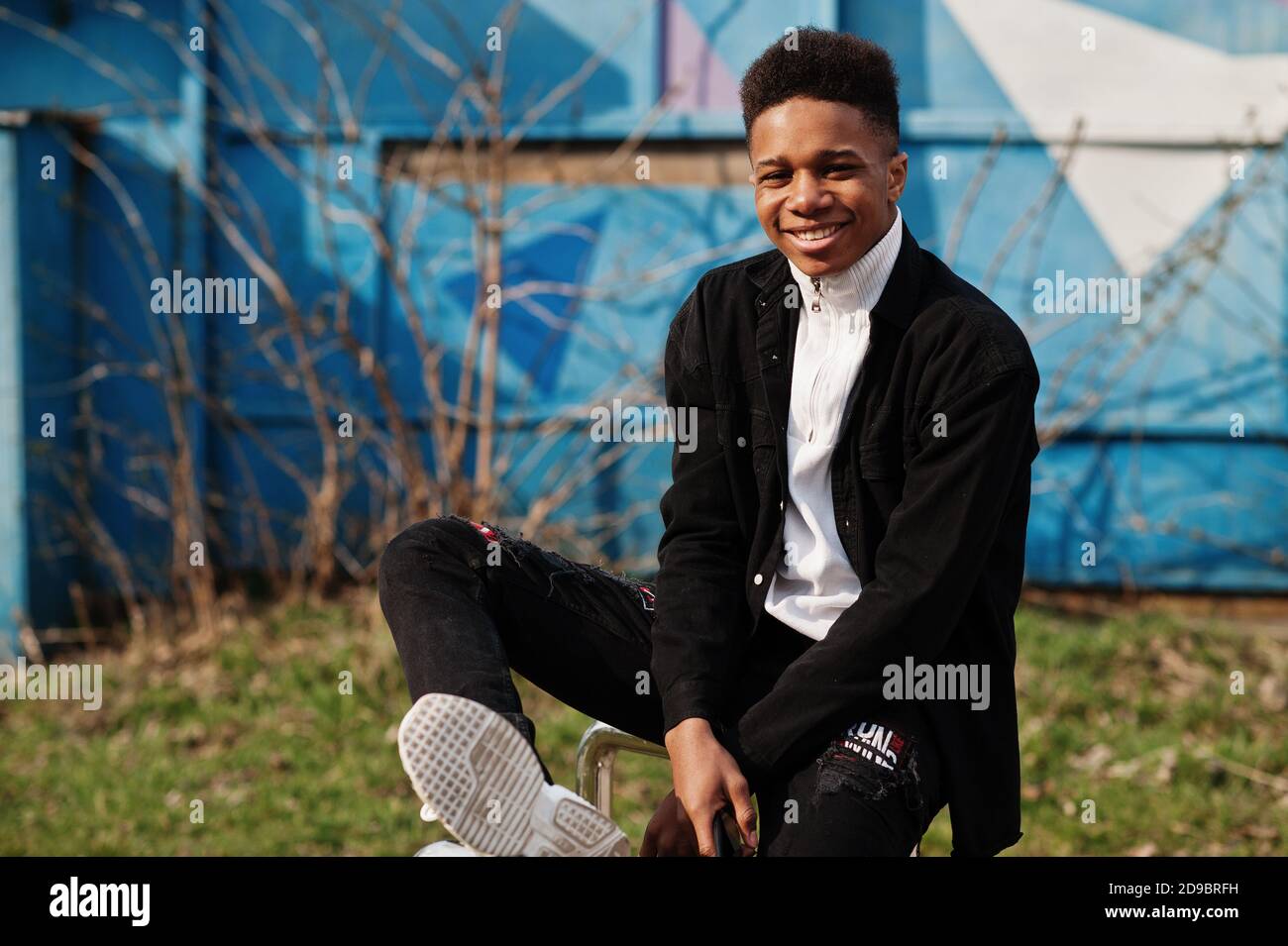 Young millennial african boy in city. Happy black man. Generation Z ...