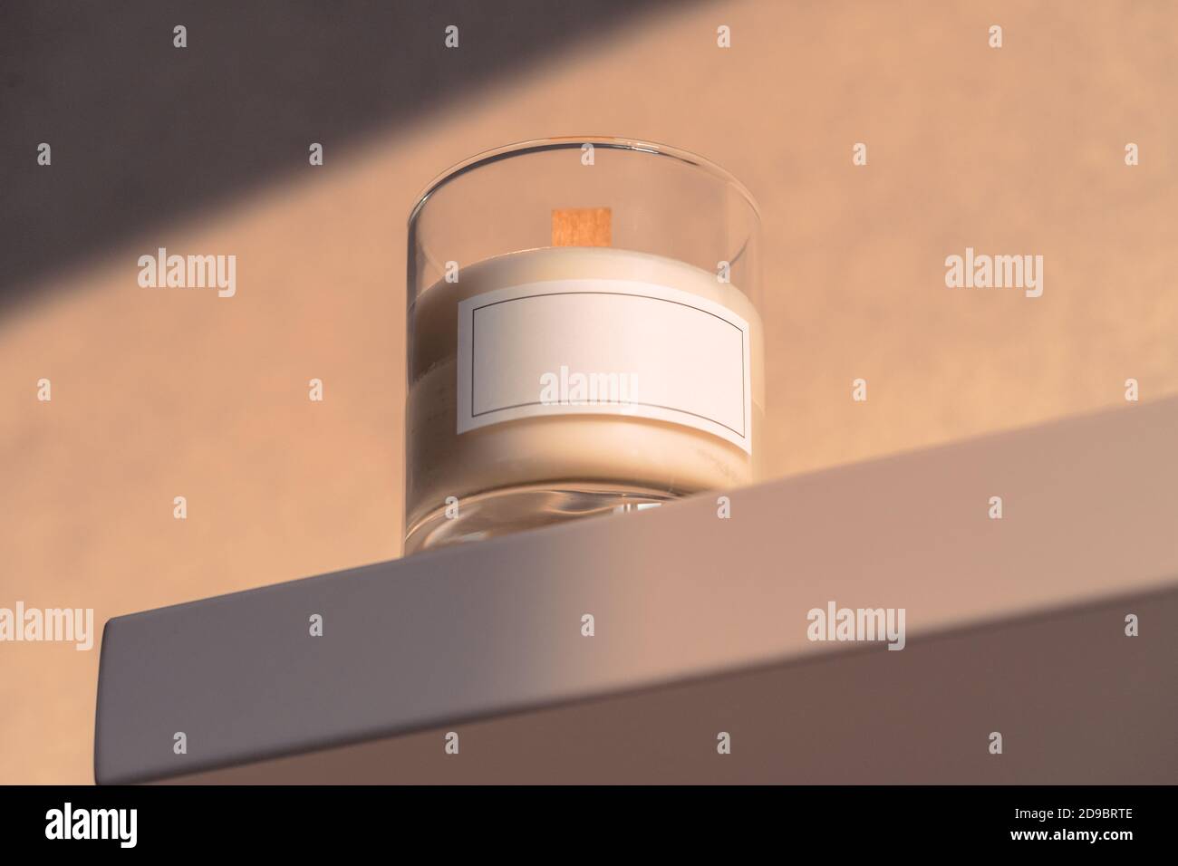 Scented Candle In Glass With Blank White Label On Shelf In Sunbeam ...