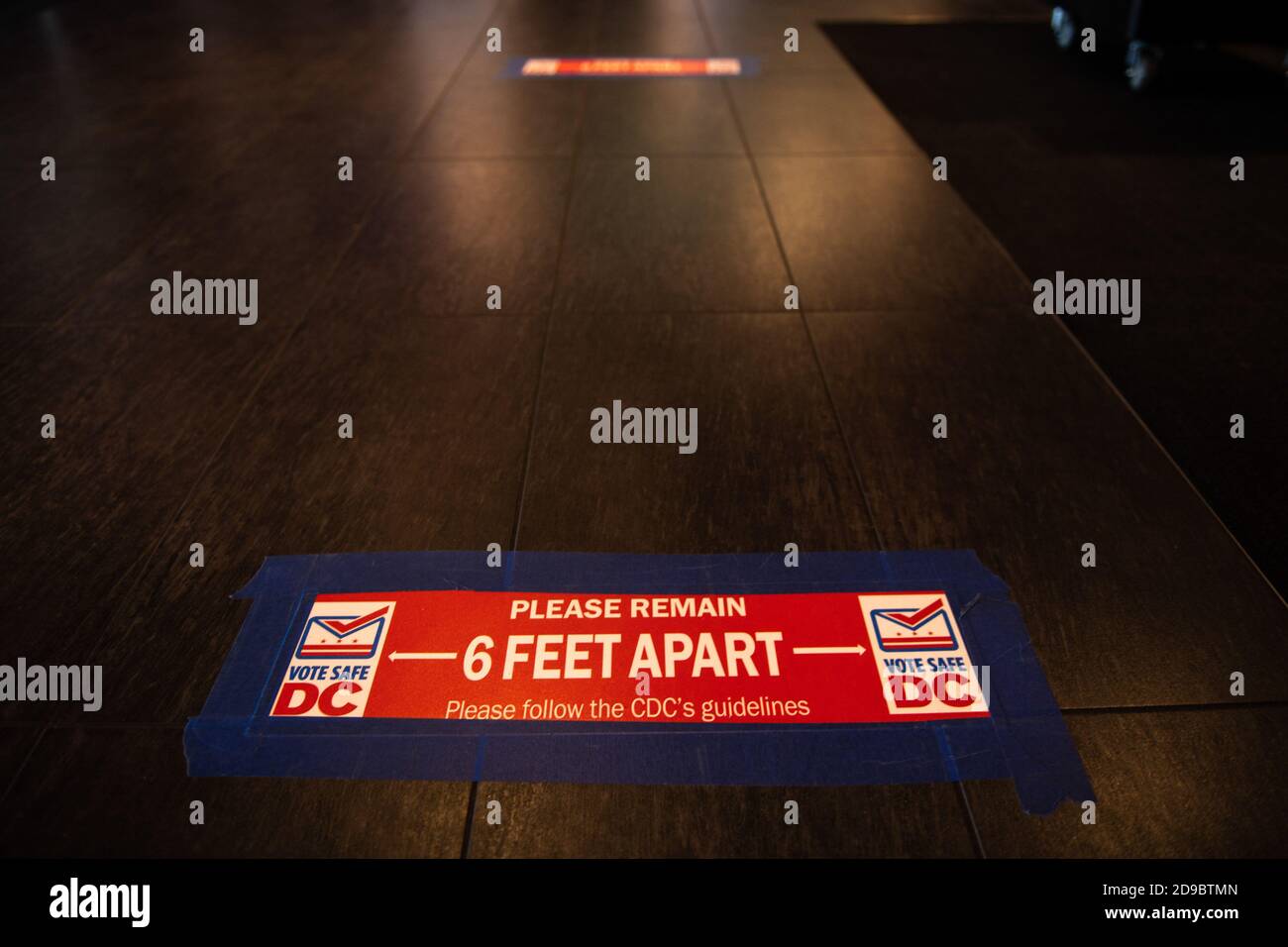 WASHINGTON D.C. NOVEMBER 3- A 6 feet apart sign is taped on the floor ...