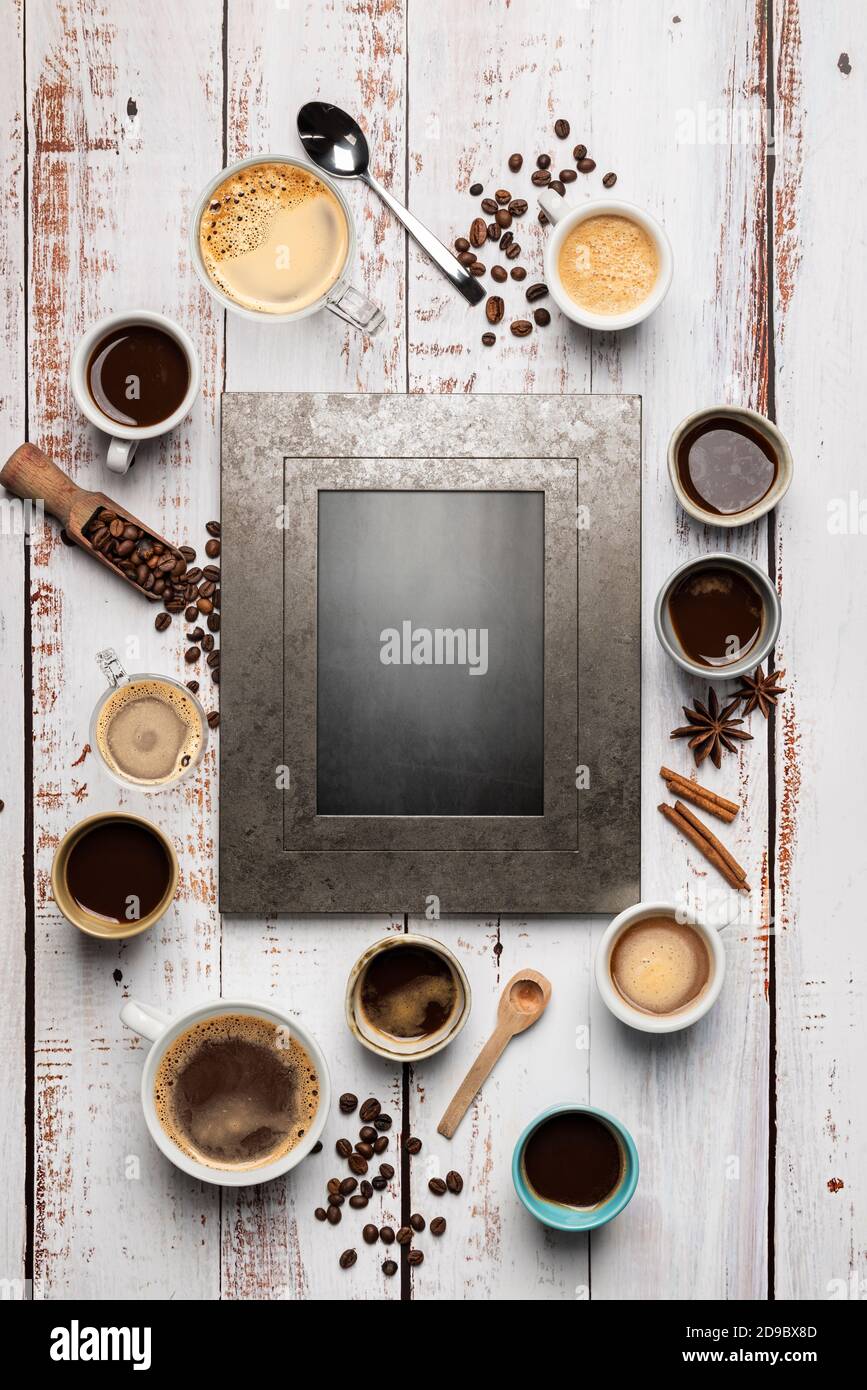 Vertical top view composition with various coffee cups and frame for ...