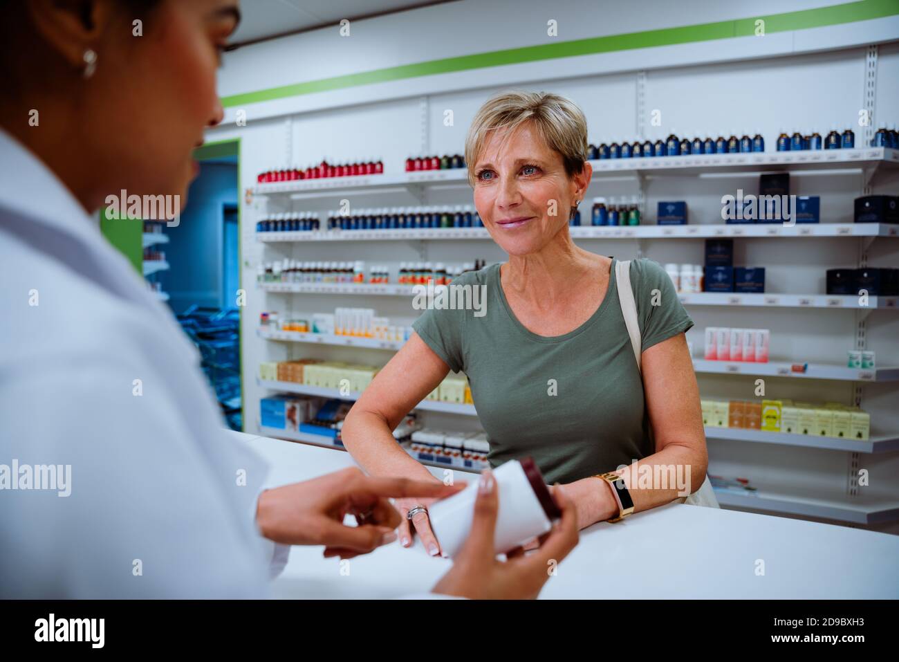 New student intern chemist assisting mother purchasing medication for ...