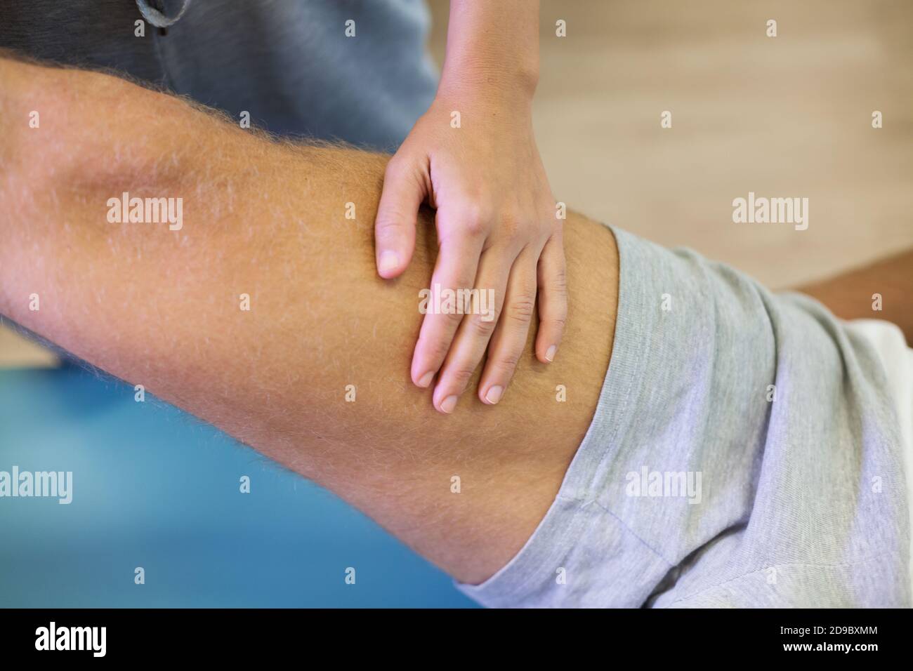 Physiotherapist consulting with patient leg problems. Physical therapy ...