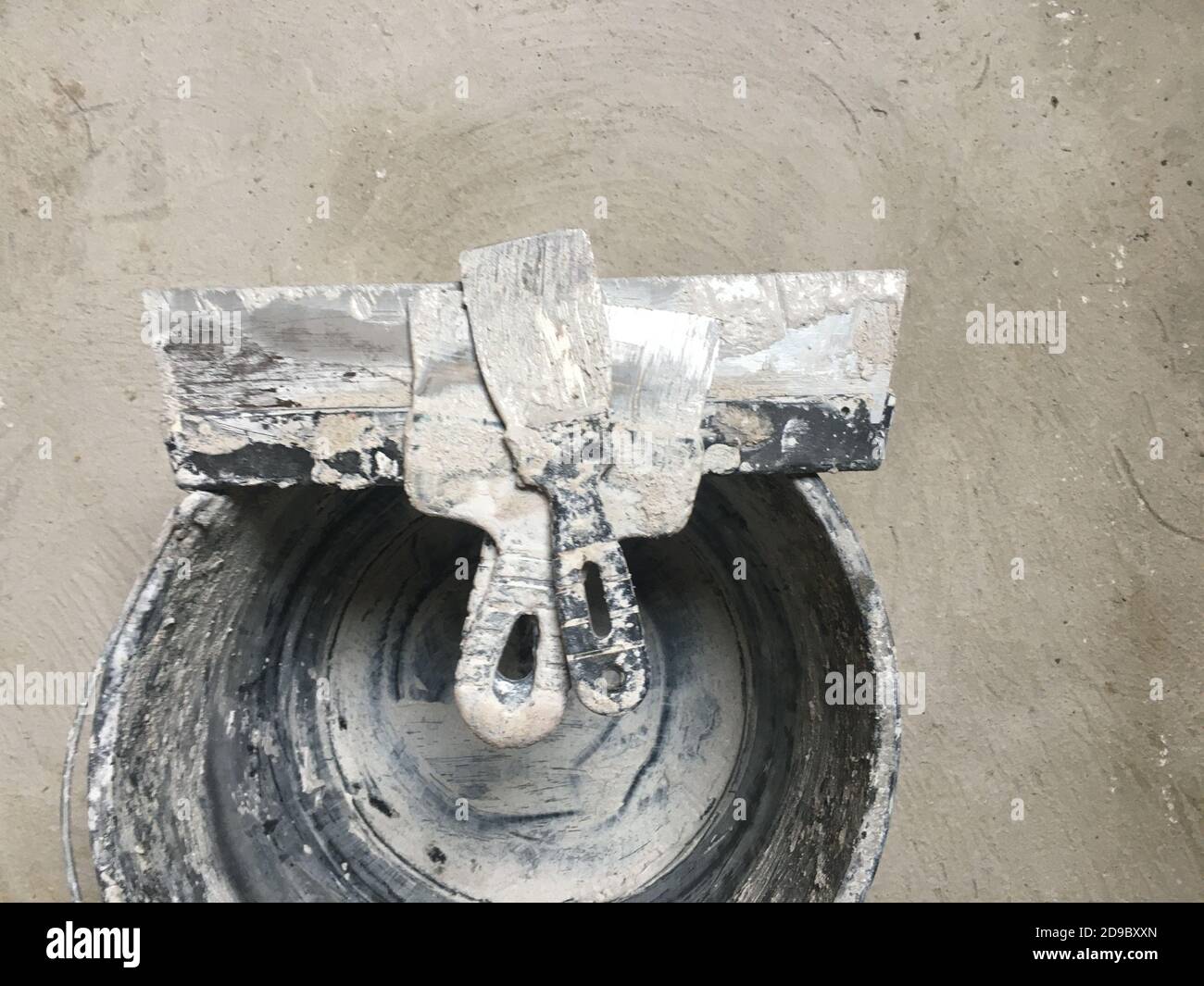 spatulas and buckets for plastering walls. a working tool during the ...