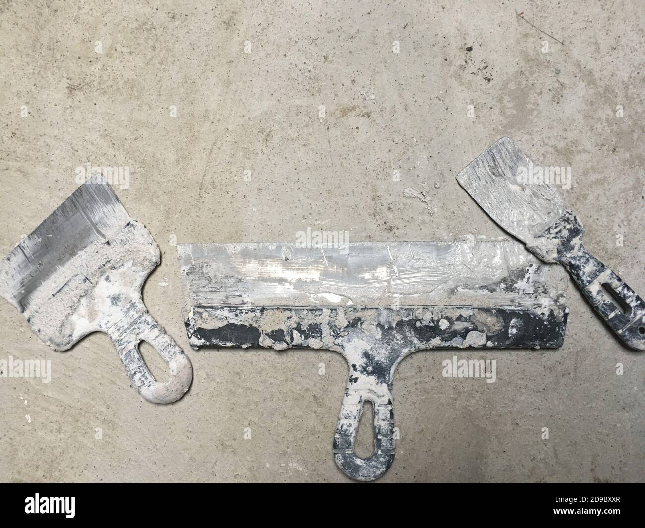 spatulas and buckets for plastering walls. a working tool during the ...