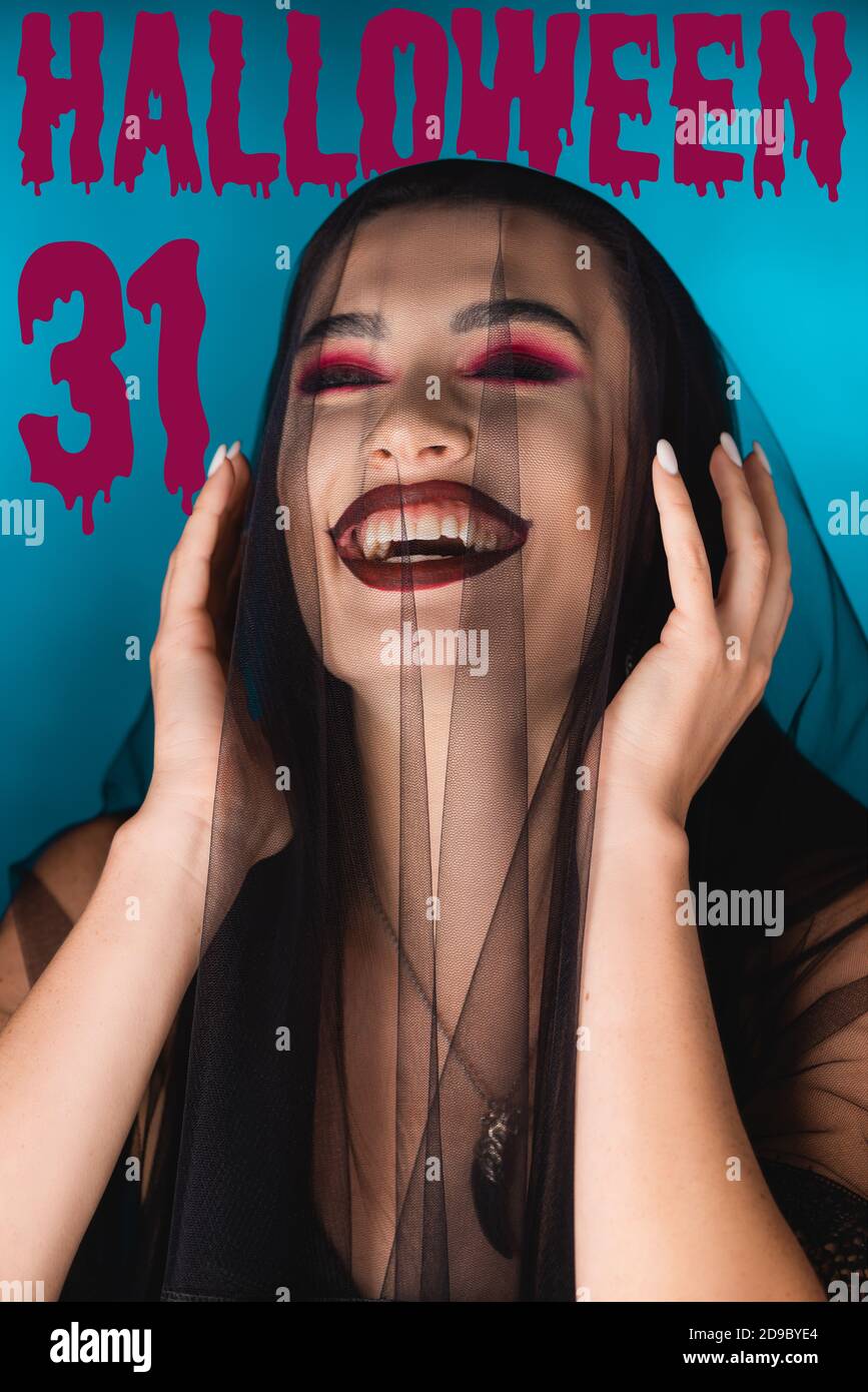 evil woman with black makeup, closed eyes and veil laughing near ...