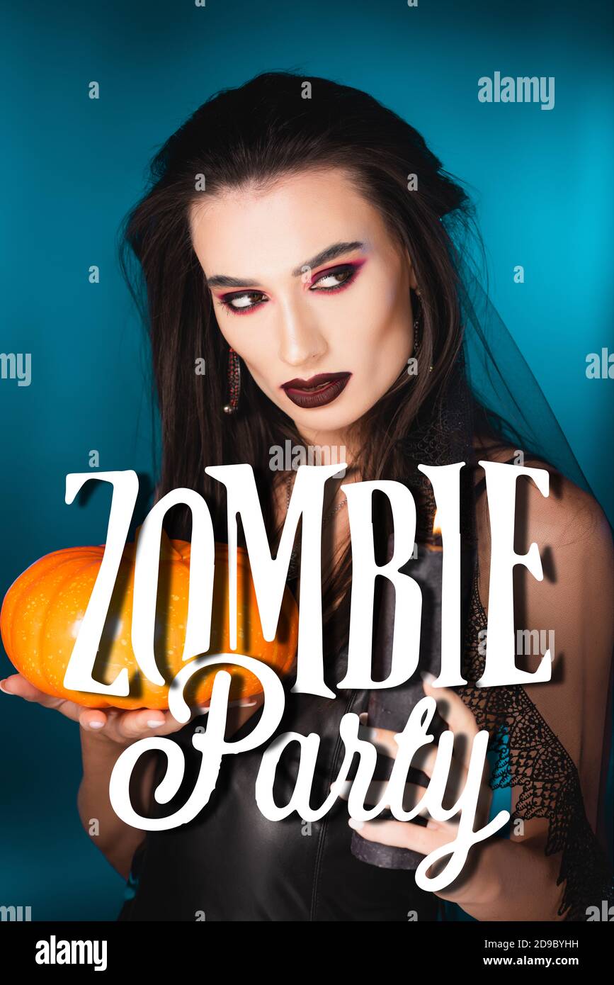 young pale woman with black makeup and veil holding burning candle and ...