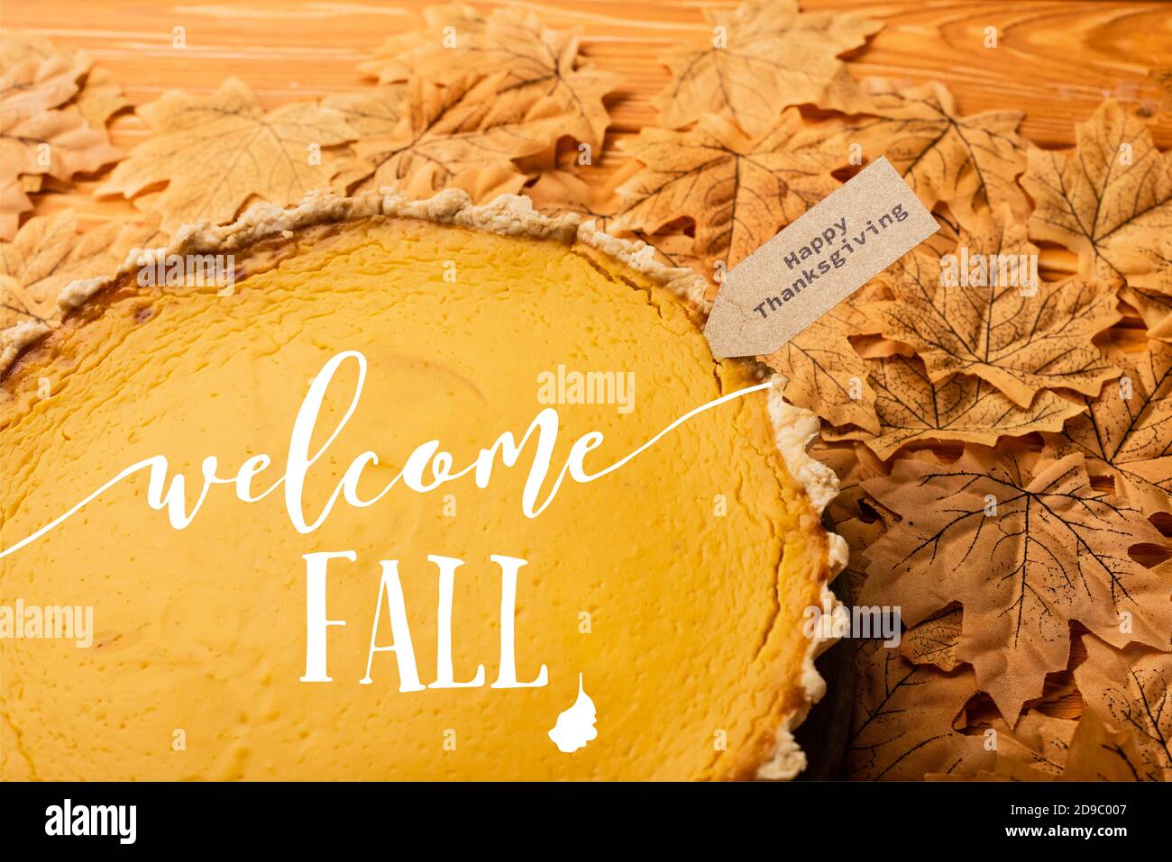 pumpkin pie with welcome fall lettering and happy thanksgiving tag on ...