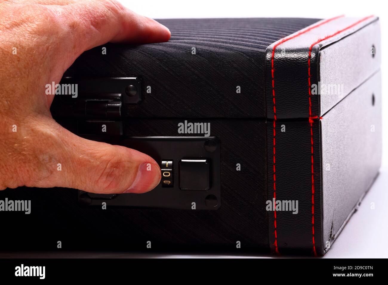 Mans Hand Inputing The Code Numbers For A Combination Lock On A Mans Hand Inputing The Code Numbers For A Combination Lock On A