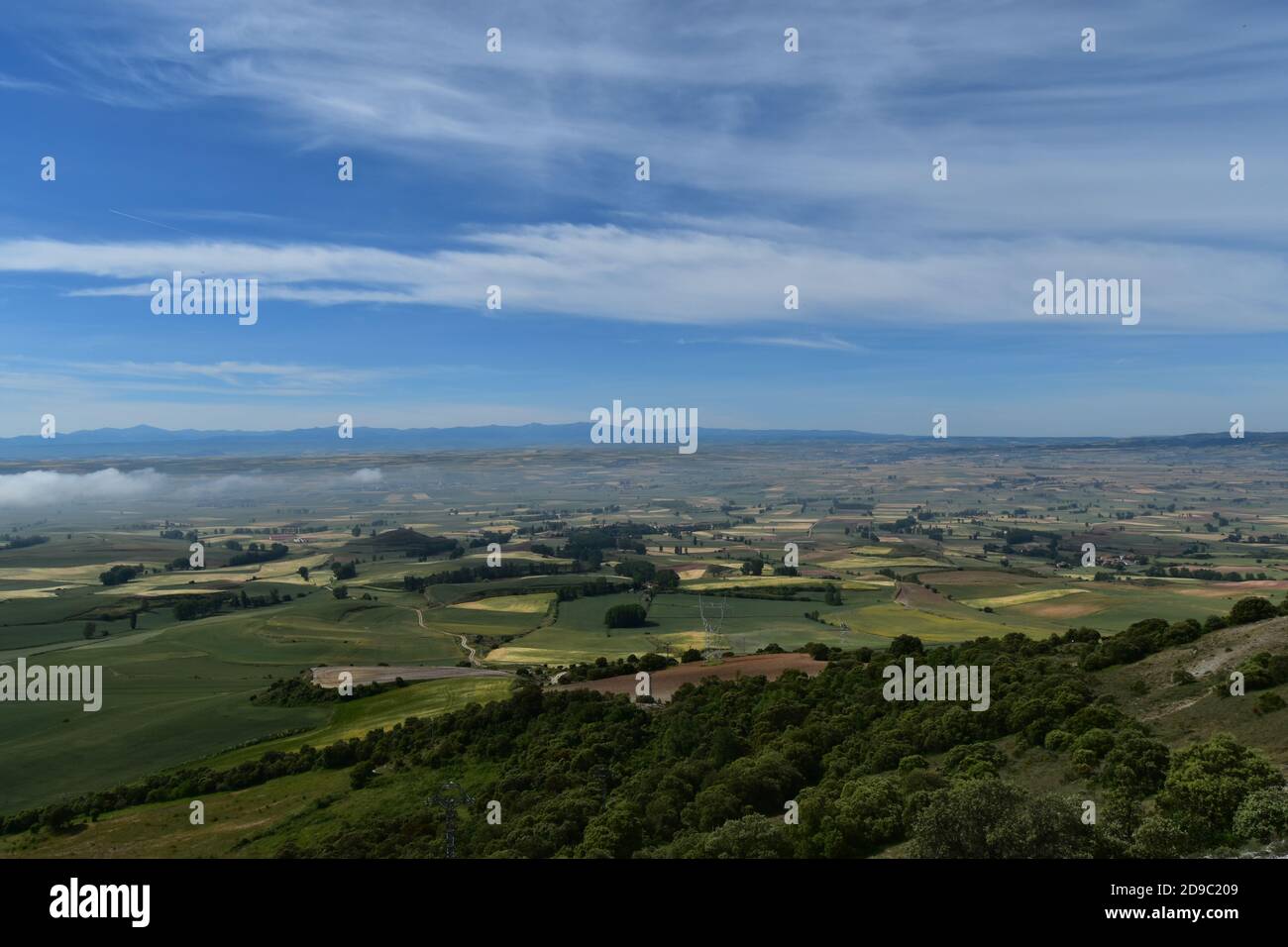 Aerial shot of farm fields under a cloudy sky in the countryside Stock ...