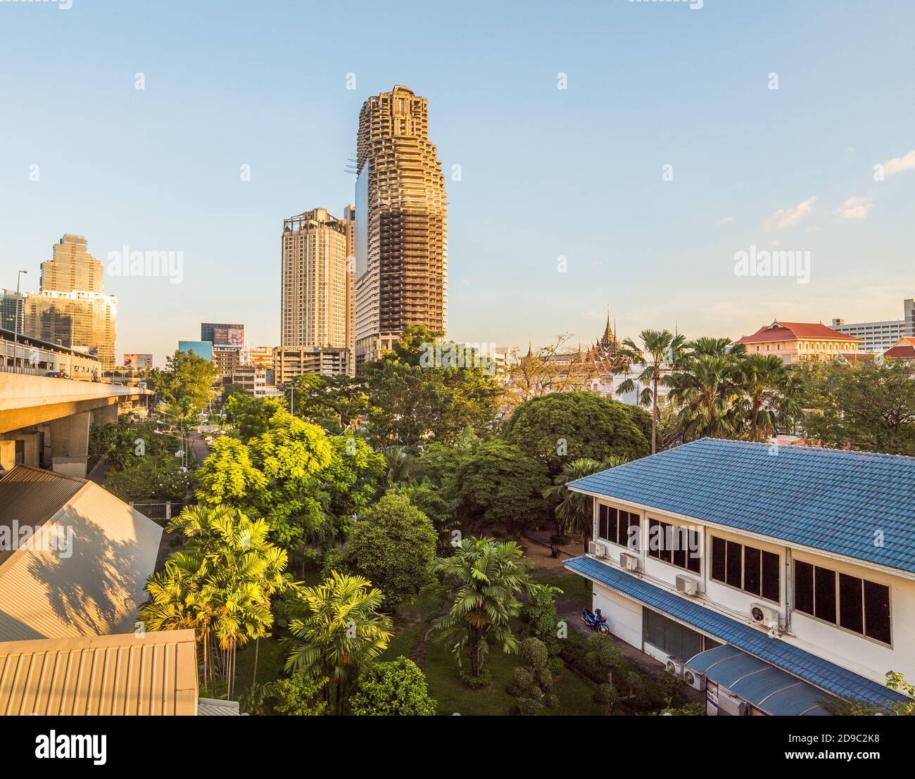 Urban Scene. Abandoned Skyscraper with Greenery Lit by Golden Light in ...