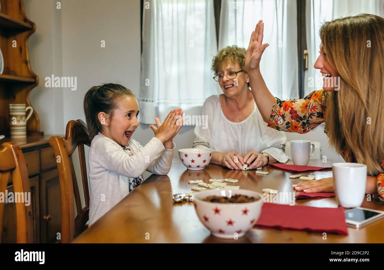 Little girl winning domino Stock Photo - Alamy