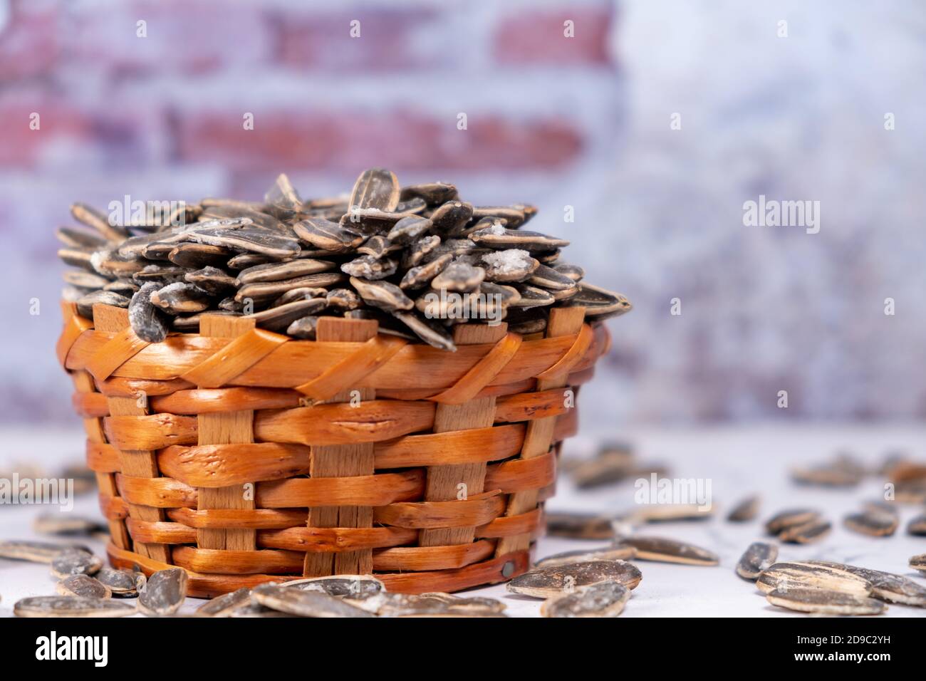 The view of large salted roasted sunflower seeds in a small basket ...