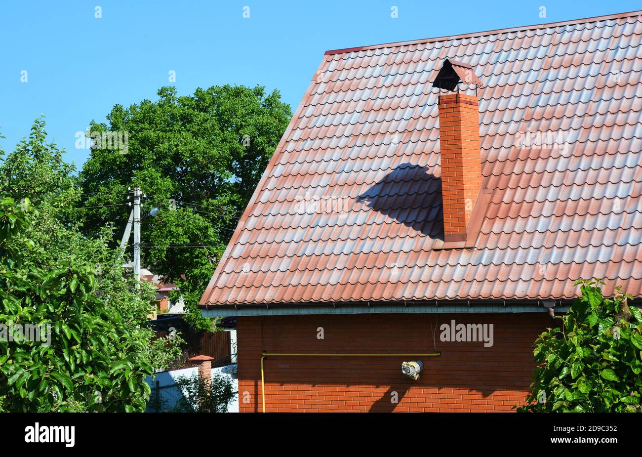 Faded metal roof lost its color, is in bad condition and needs painting ...