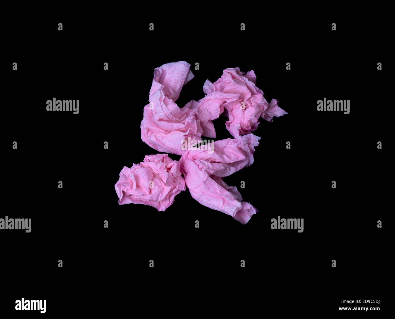 Warped used tissue paper isolated on black background Stock Photo - Alamy