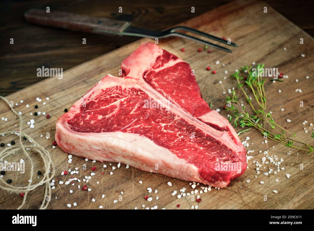 uncooked t bone steak of beef on the butcher's Board Stock Photo - Alamy