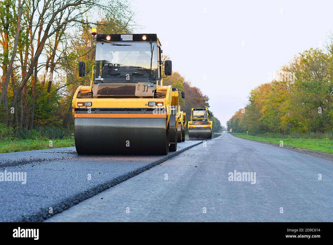 Close view on the road roller working on the new road construction site ...