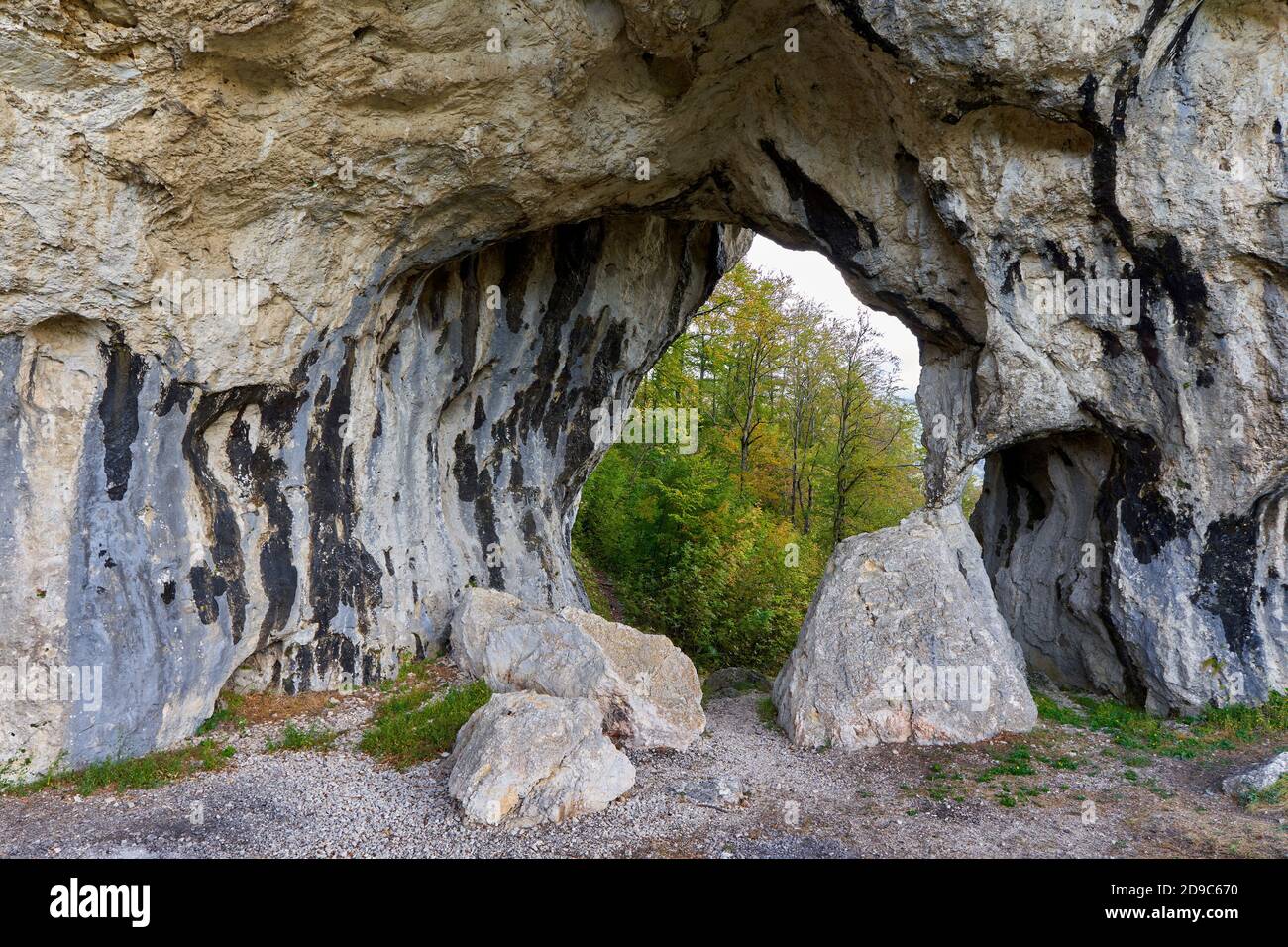 Natural stone arch in the mountains of Romania Stock Photo - Alamy