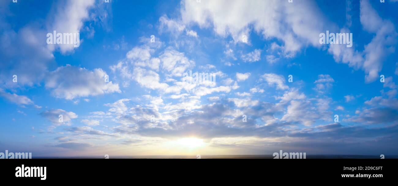 Panorama of bright evening and morning sky, shining sun Stock Photo - Alamy