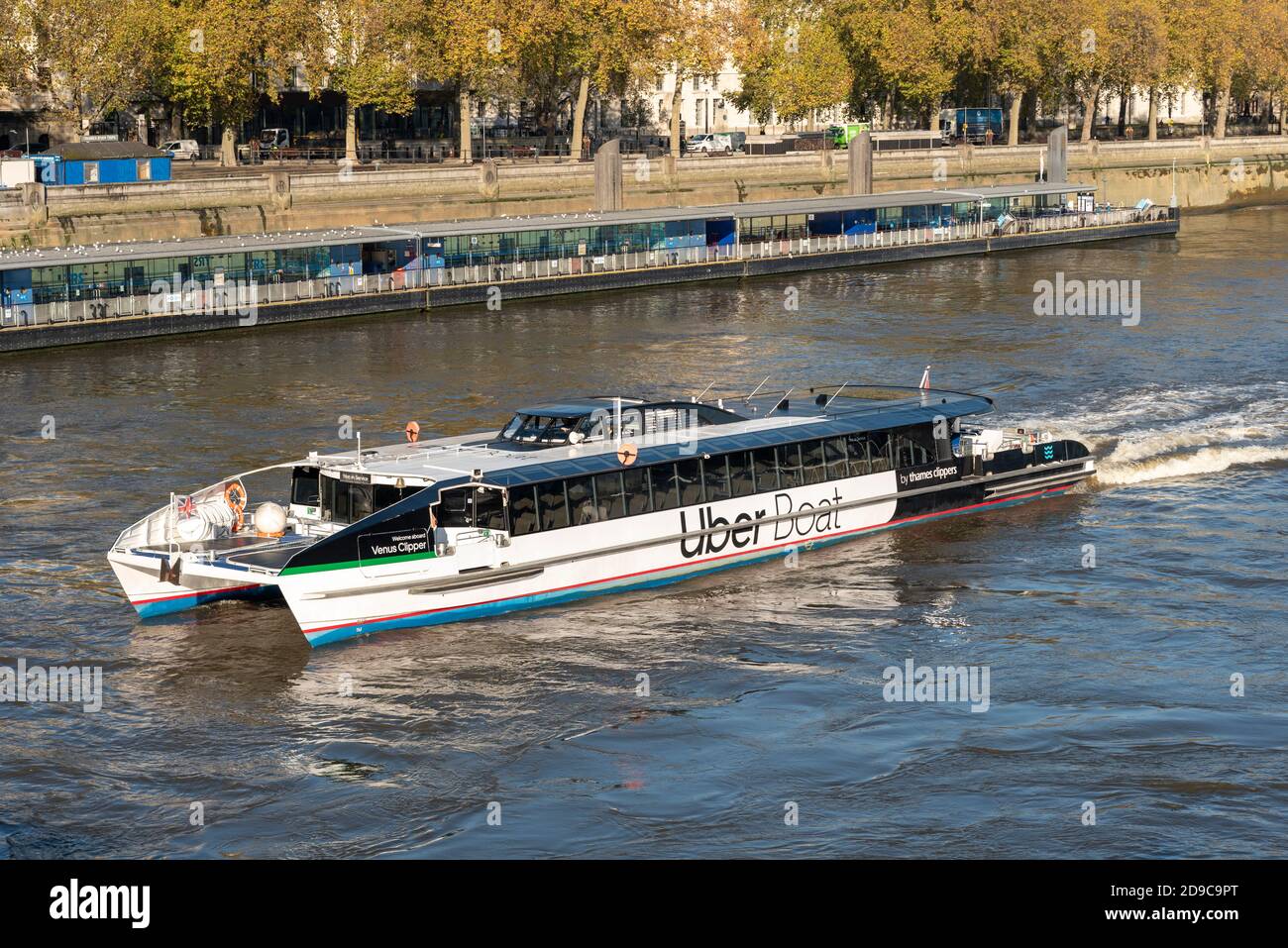 Uber boat on the River Thames, London, UK. Venus Clipper approaching ...