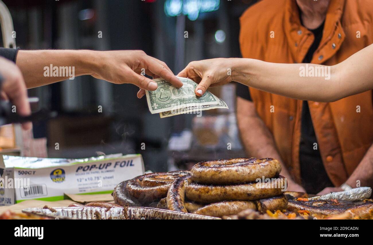 A person paying money for food purchased. New York, USA Stock Photo - Alamy