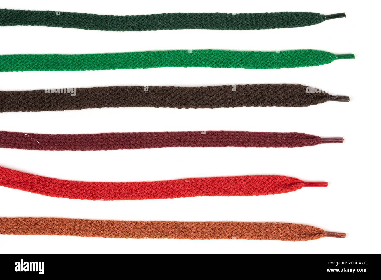 Collection of colored cotton laces for shoes with tip on white ...