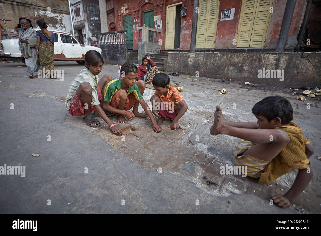 Kolkata, India, January 2008. Children play on the street in Kalighat ...