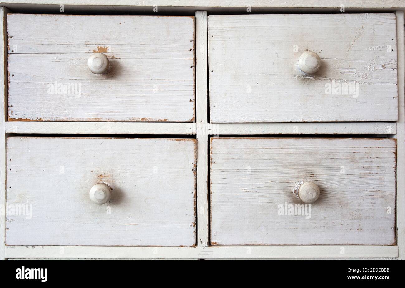 Furniture detail shot of vintage old white wooden chest of drawers ...