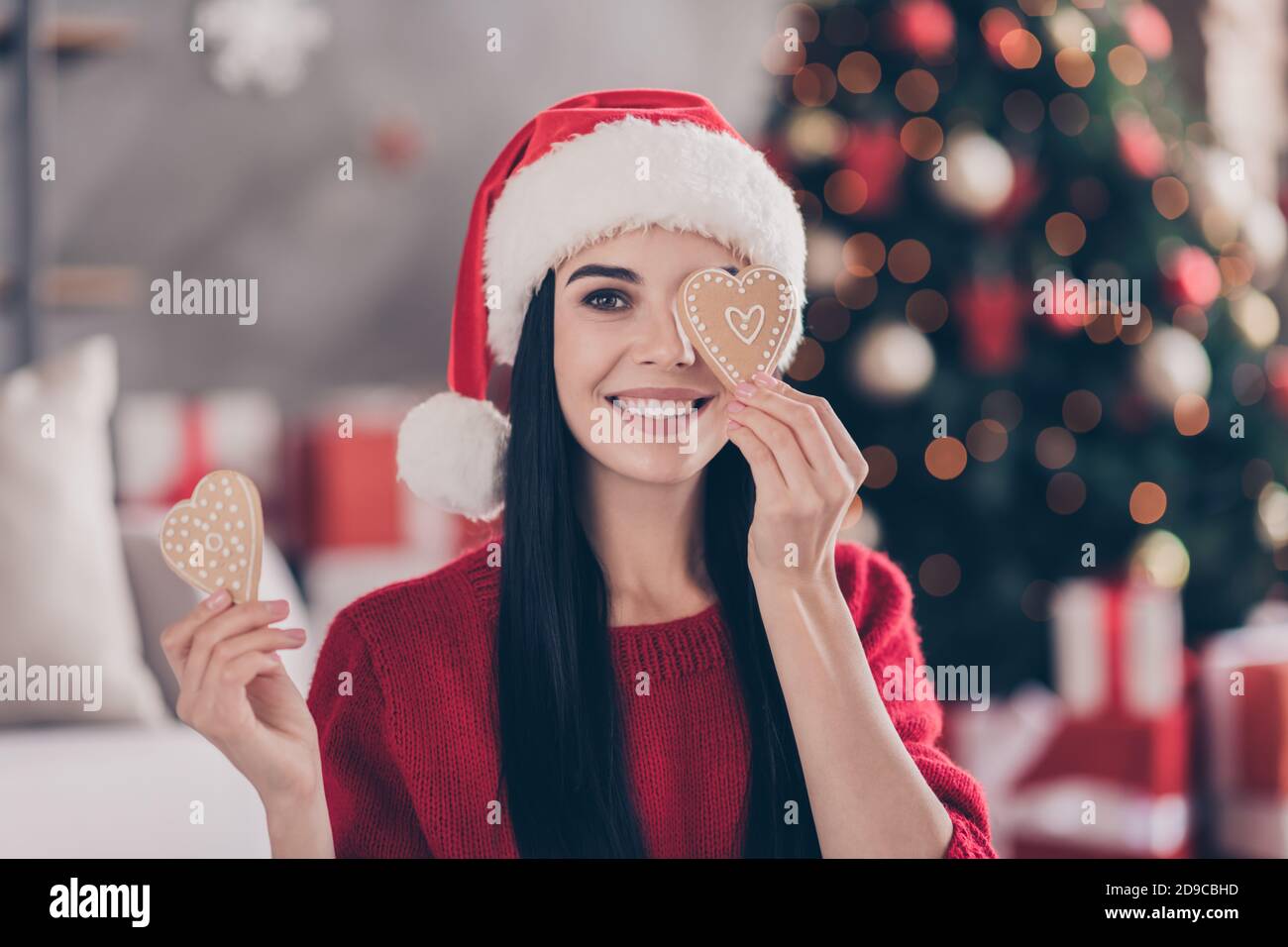 Photo of cute funky lady hold two heart figure biscuits cover eye wear ...