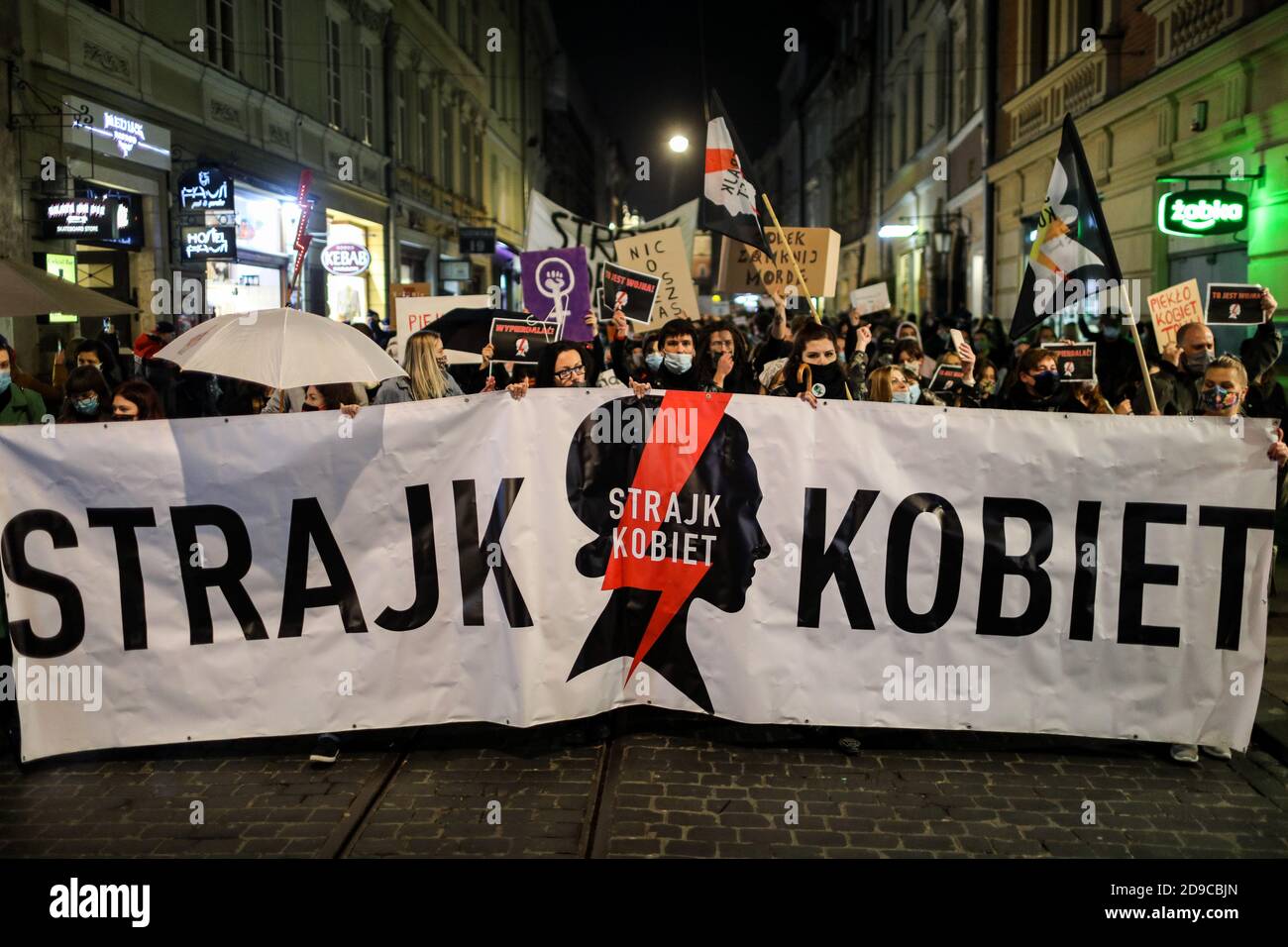A protesters seen with a banner with a logo of Polish Women's Strike ...