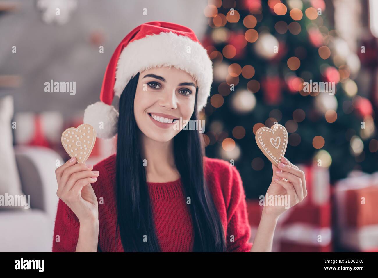 Photo of young lady look camera hold two heart shape biscuits wear ...