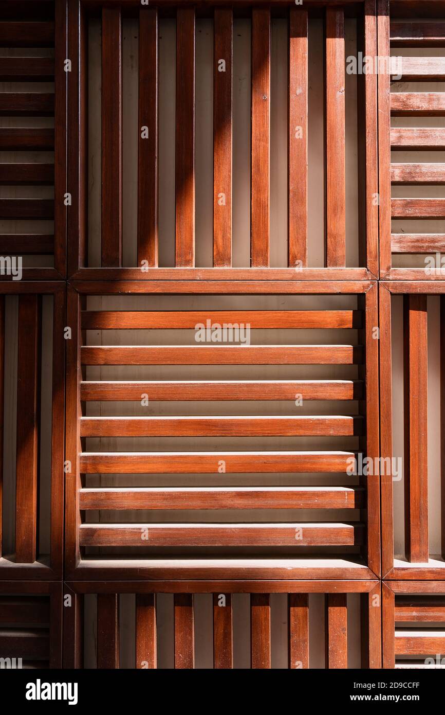 Seamless texture - a wall lined with wooden plaque lightened by sun ...