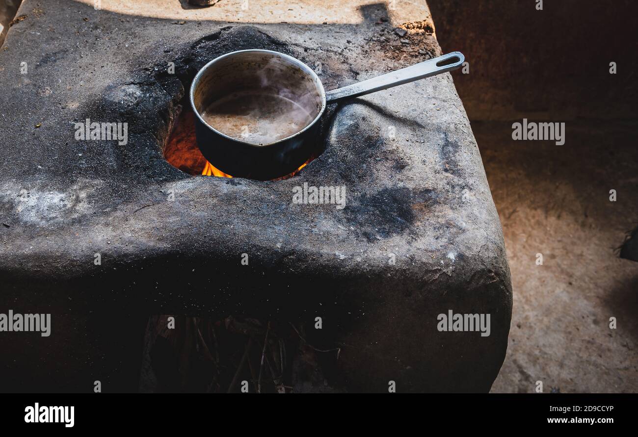 Hand of A Street Hawker preparing Tea on a Clay Oven Stock Photo - Alamy