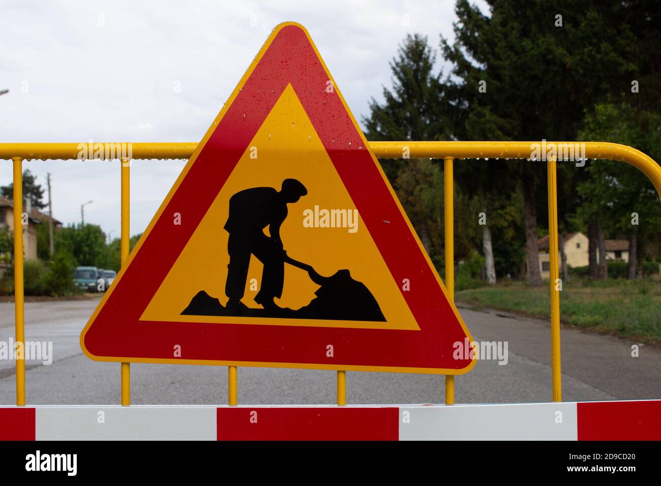 Close-up of road in construction road sign with droplets of water Stock ...