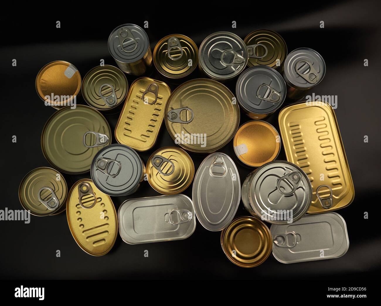 Different types of cans with prepared foods for consumption, vegetables ...