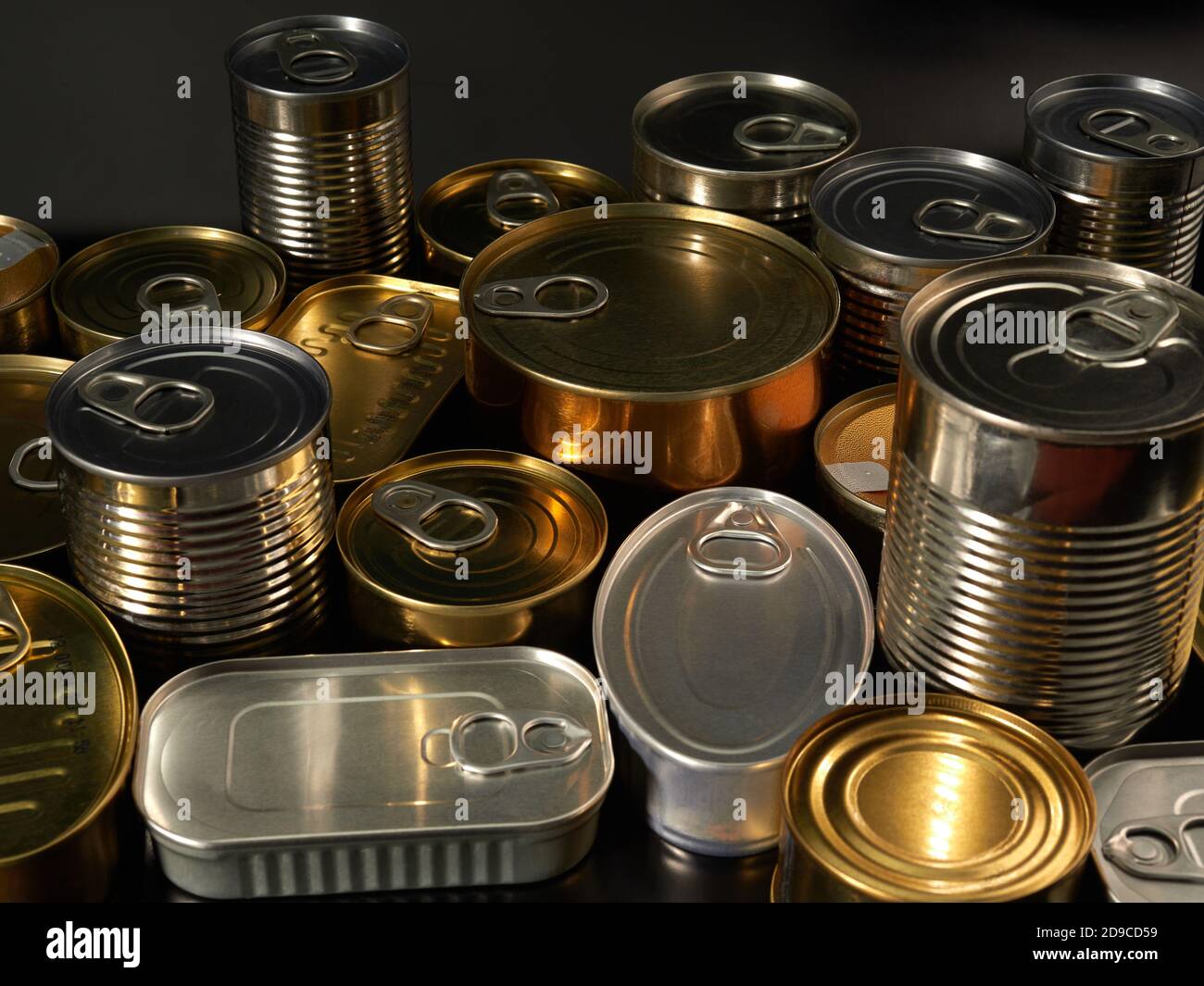 Different types of cans with prepared foods for consumption, vegetables ...