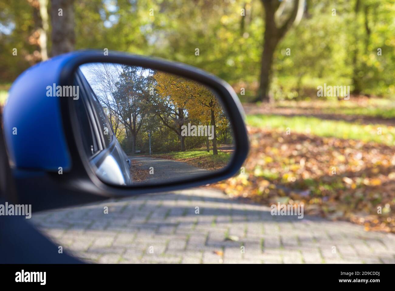 Car mirror Closeup with beautiful autumn landscape in reflection, on ...