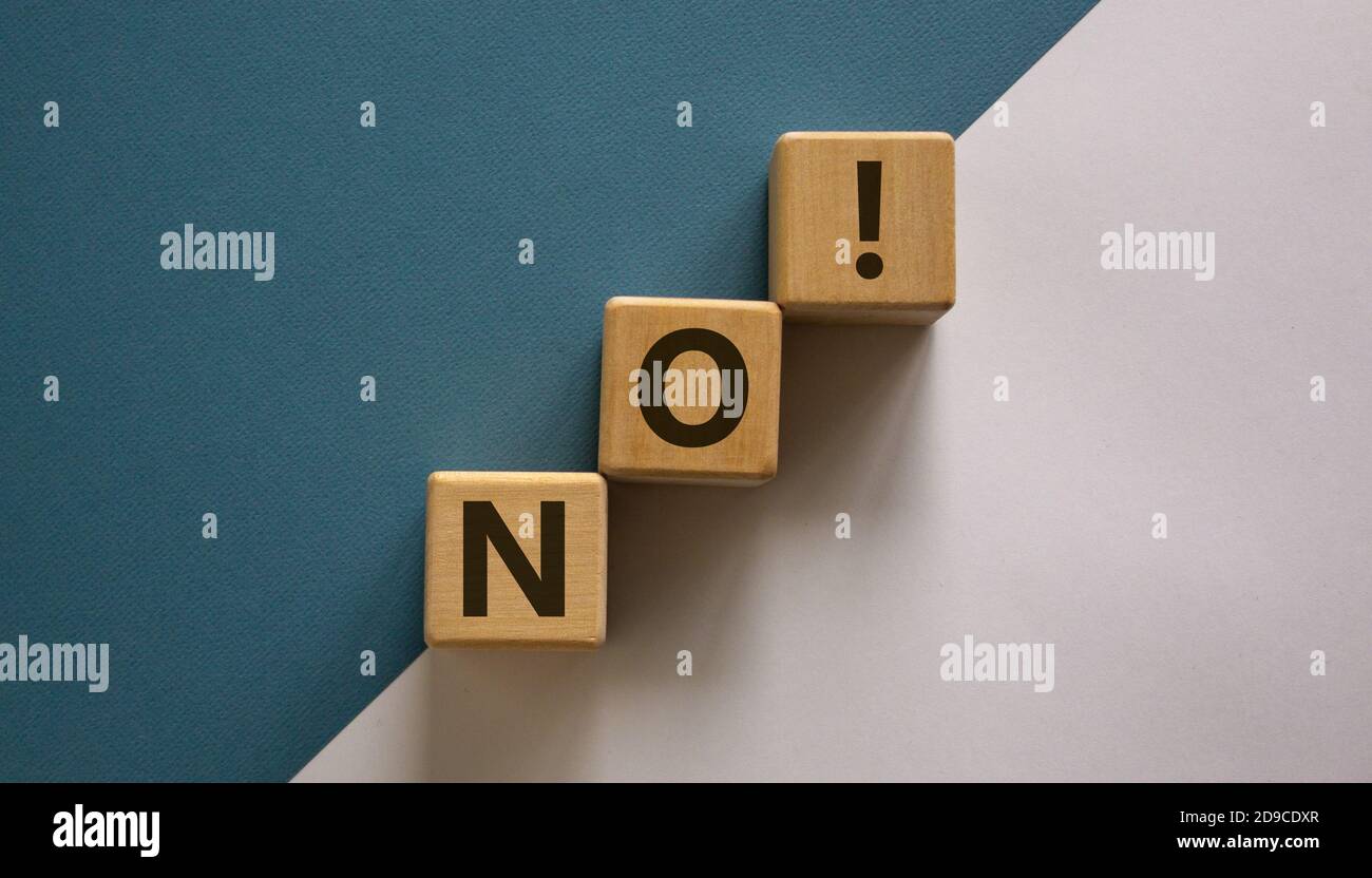 Wood blocks with word 'no' on beautiful white and blue background, copy ...