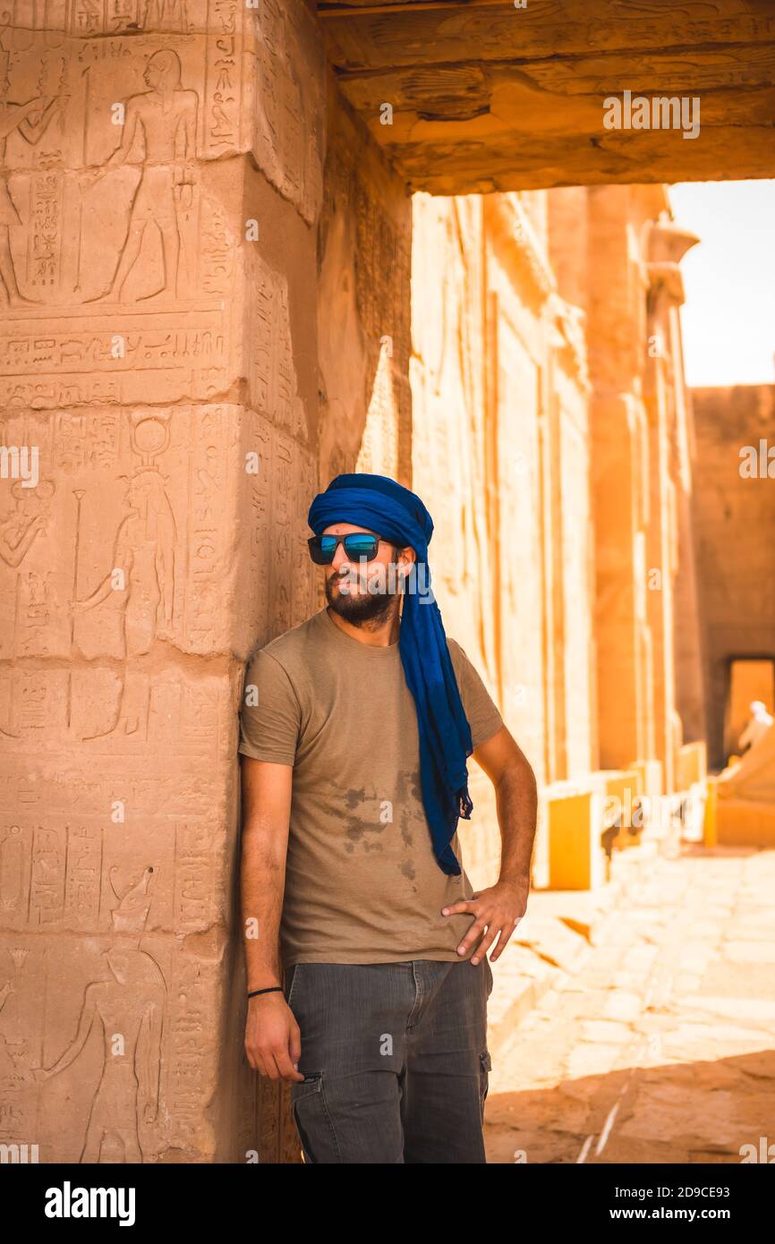 Young male wearing a blue Turban and leaning on the walls of The Temple ...