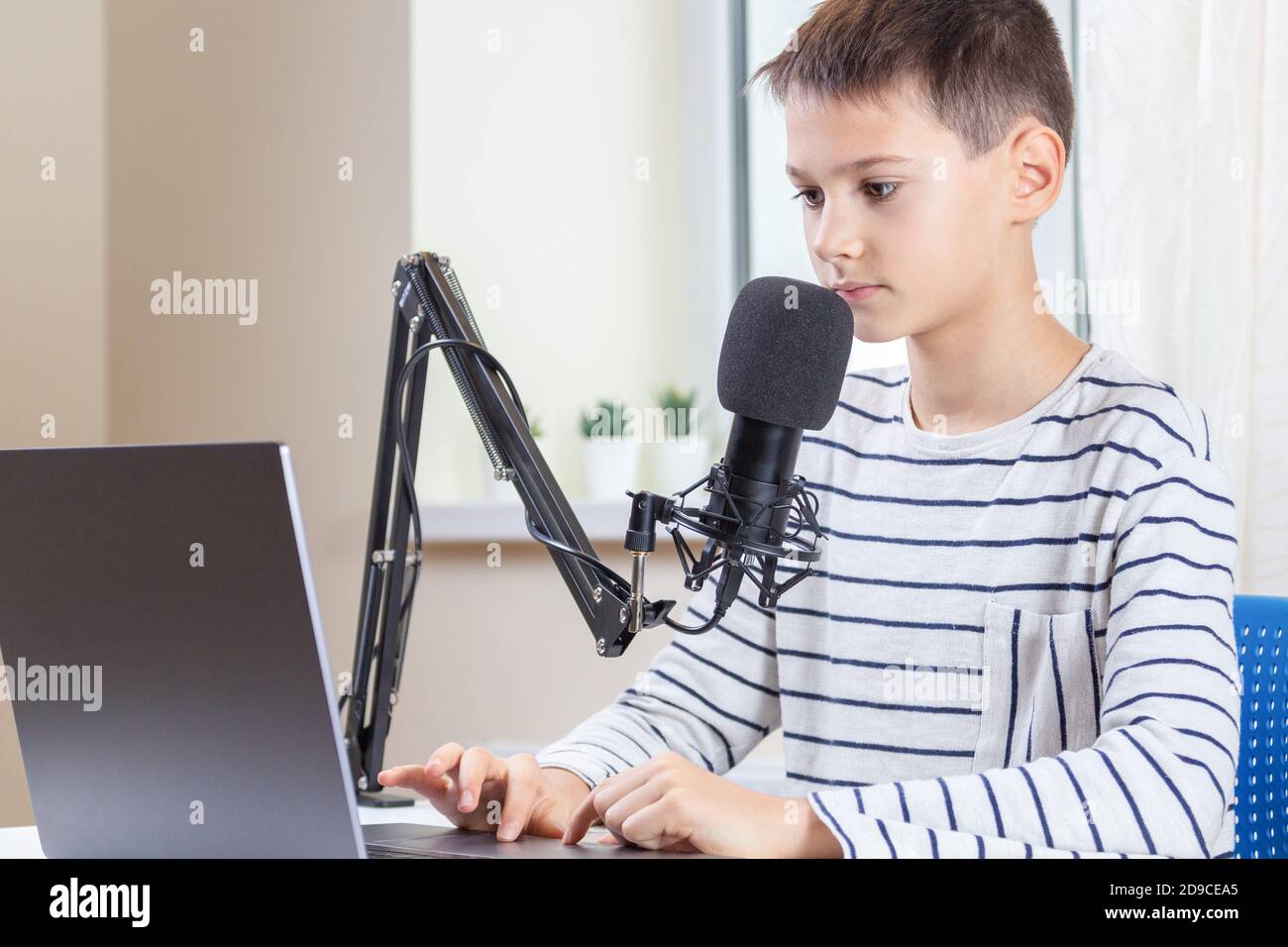 Online learning, remote education, technology. Kid wearing headphones ...