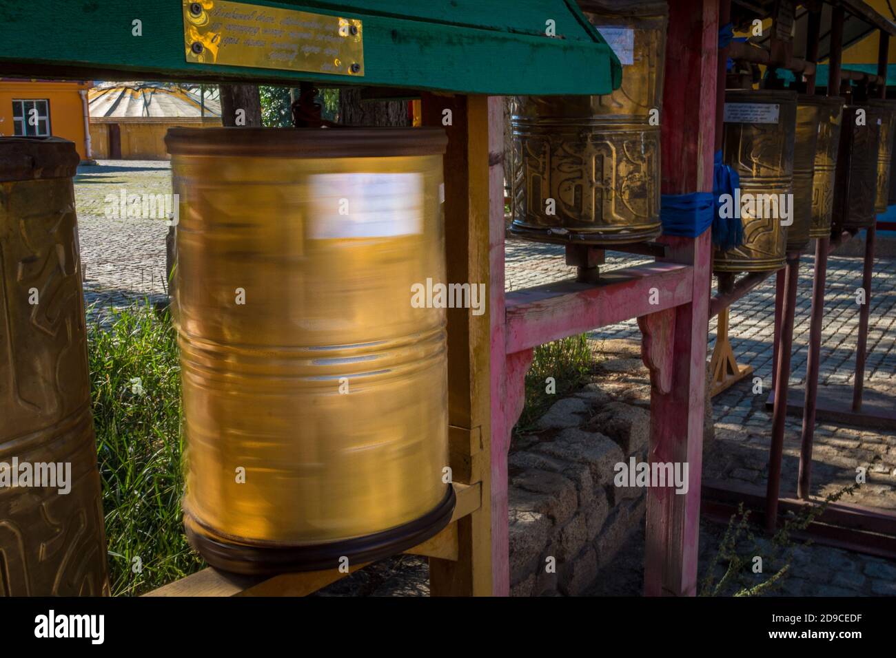 Spinning prayer wheel at a Buddhist shrine in Mongolia Stock Photo - Alamy