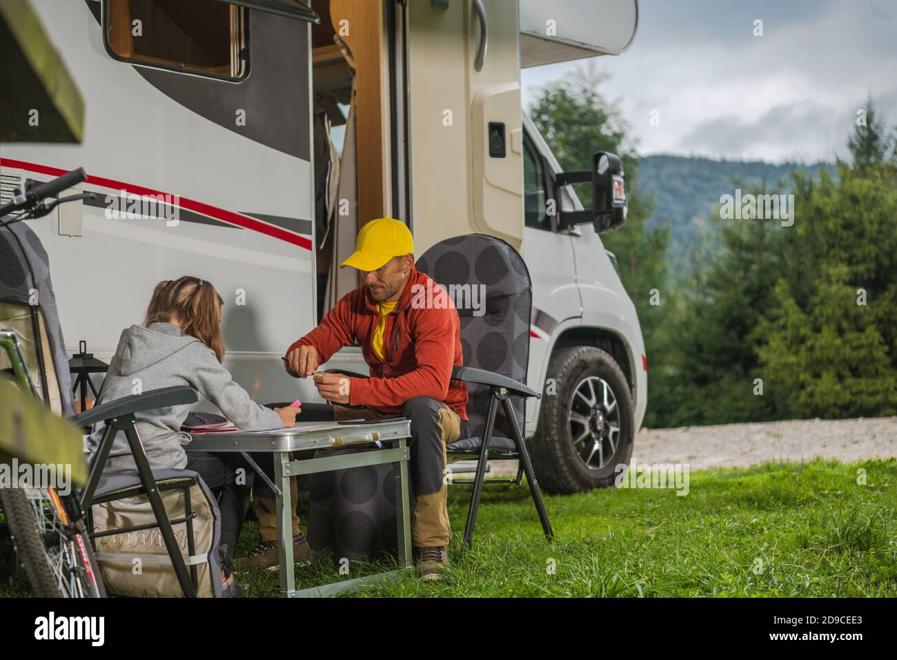 Caucasian Father with His Daughter Hanging Next to Modern Camper Van ...