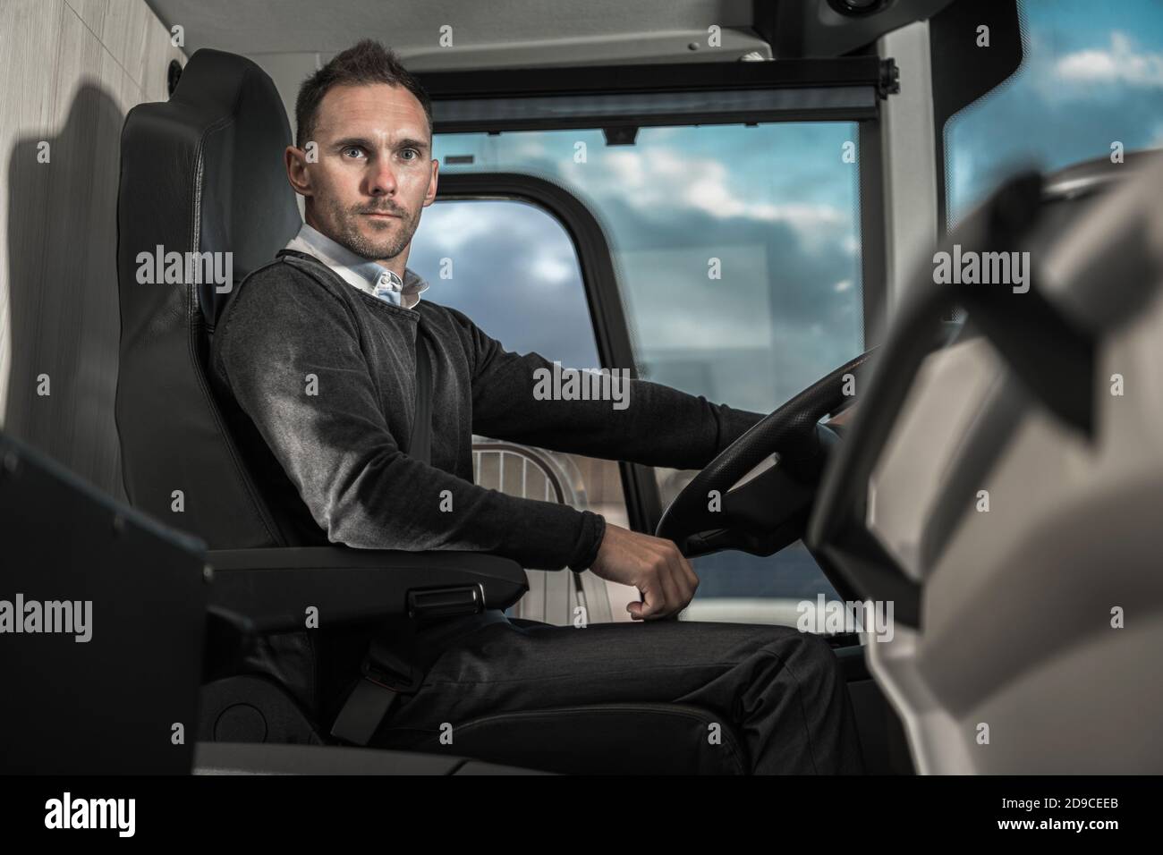 Caucasian Coach Bus Driver in His 40s Behind Modern Bus Vehicle. Public ...