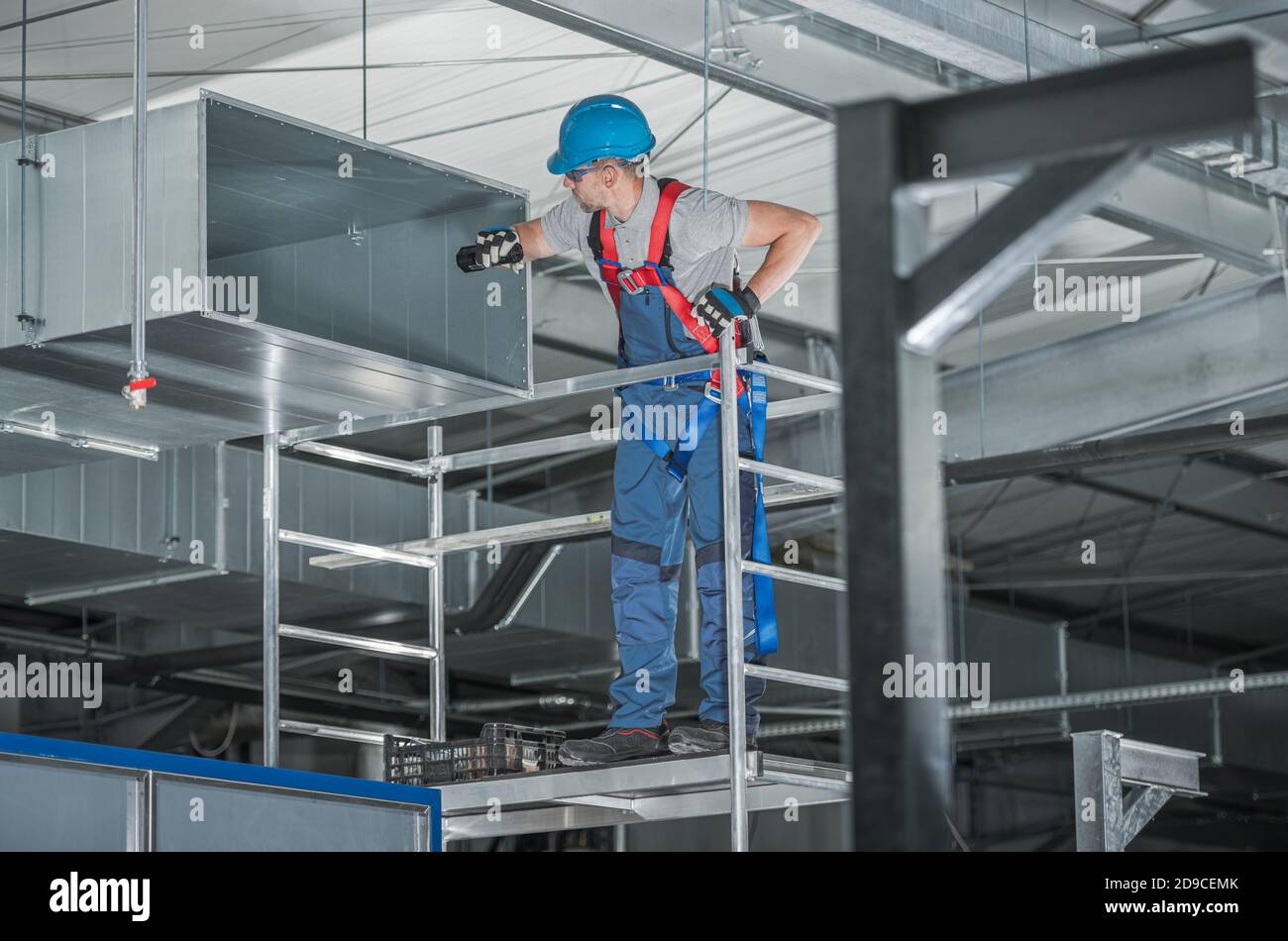 HVAC Professional Technician Worker Looking Inside Newly Built Metal ...