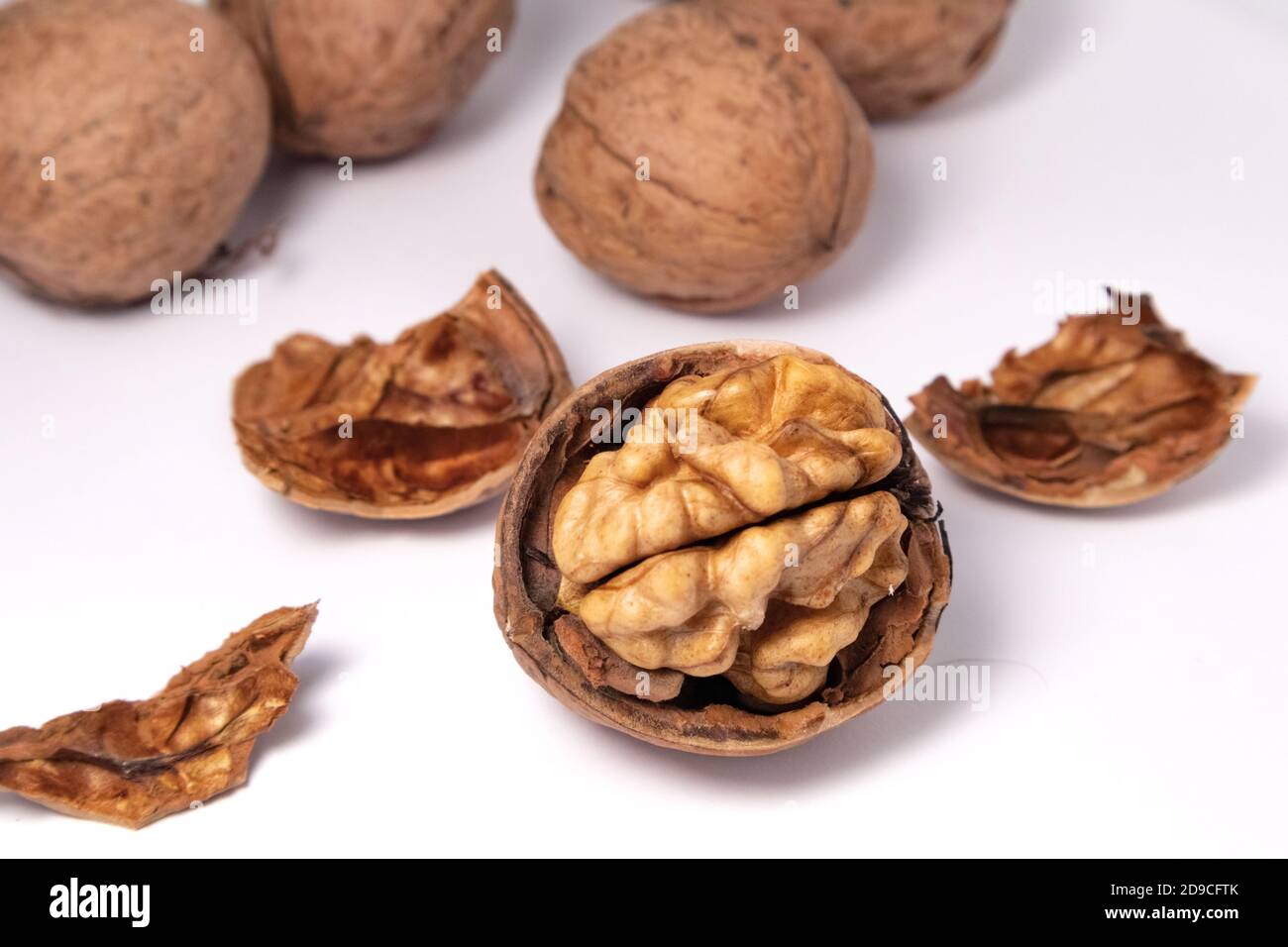 Walnuts isolated on white background. Walnut kernels and whole walnuts ...