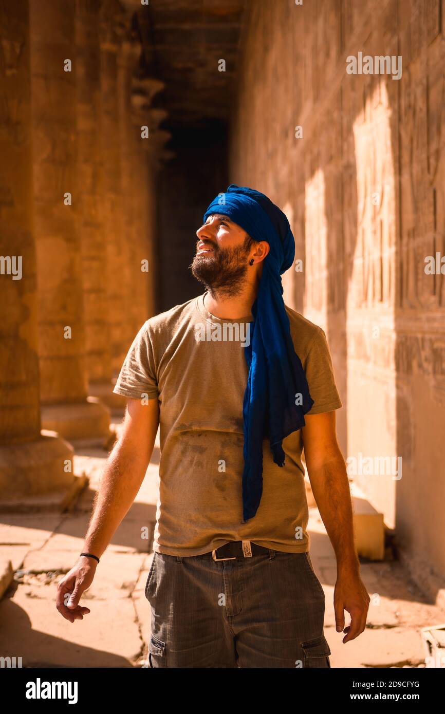 Shallow focus of a male wearing a blue Turban and walking around The ...