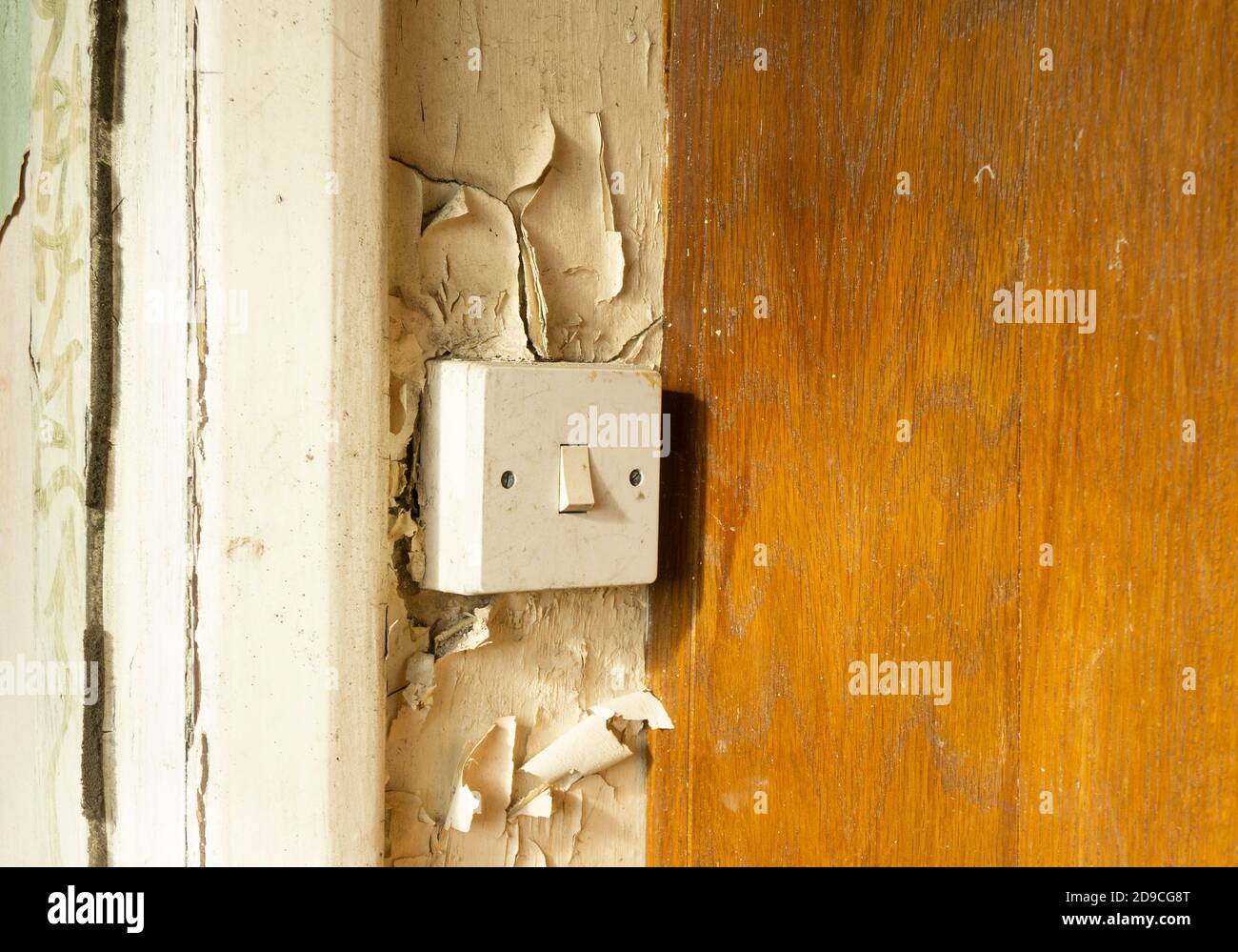 Plastic light switch on a damp wall Stock Photo - Alamy